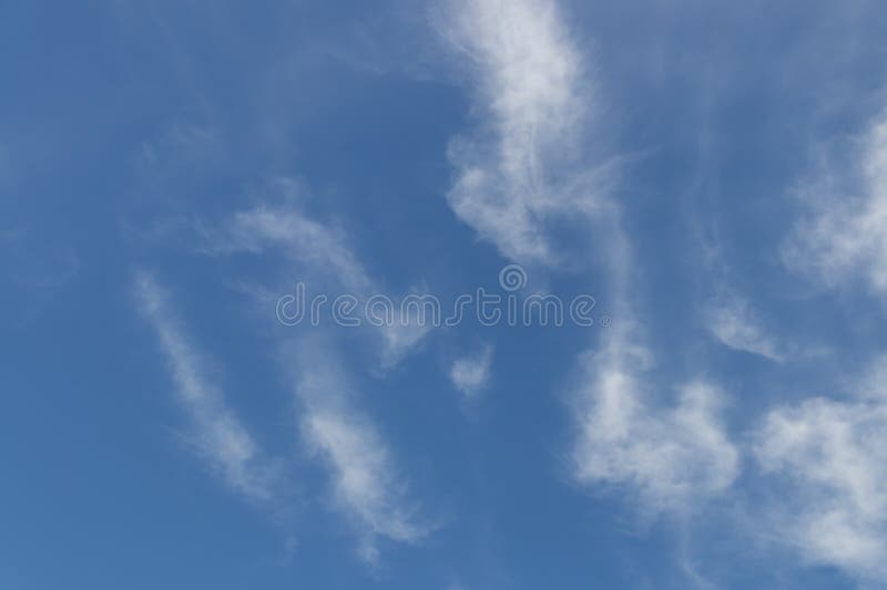 A Beautiful Display of Wispy Clouds Drifting Across a Bright Blue Sky, Inviting Peaceful ...