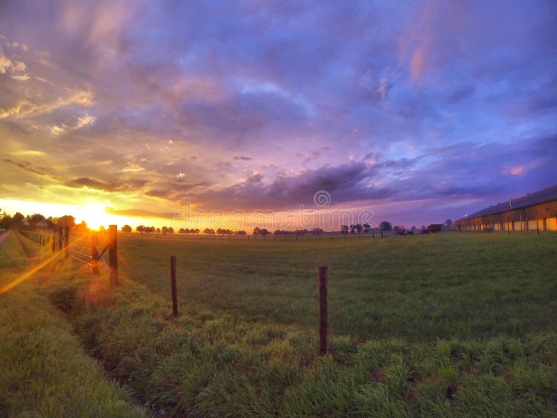 Beautiful Dramatic Sunset Over a Field Stock Image - Image of cloud ...