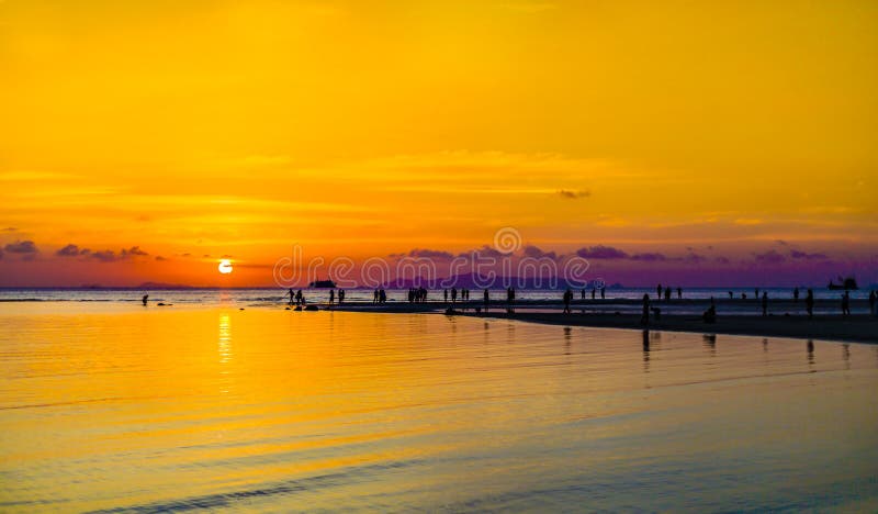 Beautiful Dramatic Sunset with People on the Beach. Stock Photo - Image ...