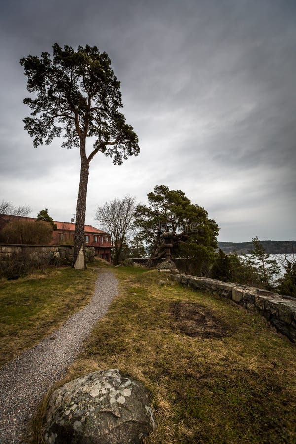 Beautiful Dramatic View of a Footpath with Trees, Building and Dark Sky ...
