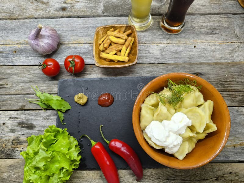 Beautiful Dumplings on a Plate Next To Various Vegetables Stock Image ...