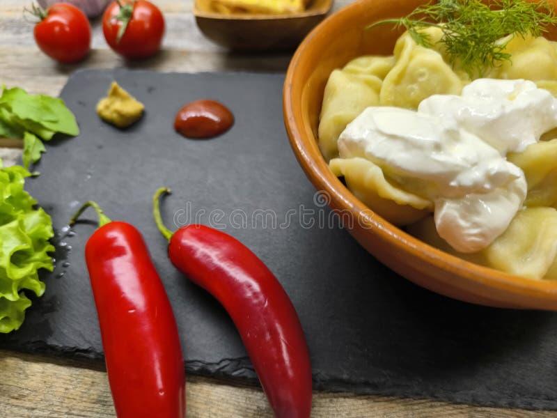 Beautiful Dumplings on a Plate Next To Various Vegetables Stock Image ...
