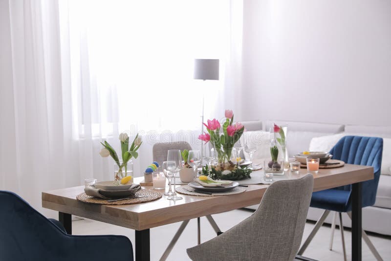 Beautiful Easter Table Setting with Beautiful Flowers in Living Room ...