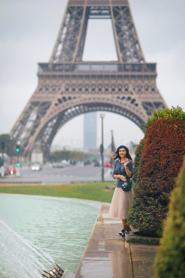 Beautiful Elegant Girl in Paris on the Background of the Eiffel Tower ... Beautiful Elegant Girl in Paris on the Background of the Eiffel Tower ...