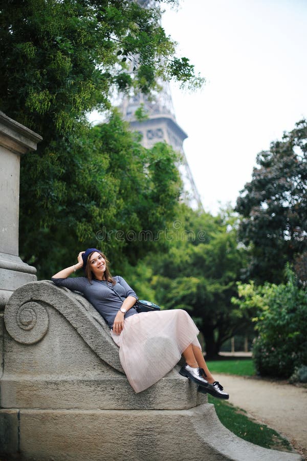 Beautiful Elegant Girl in Paris on the Background of the Eiffel Tower ... Beautiful Elegant Girl in Paris on the Background of the Eiffel Tower ...