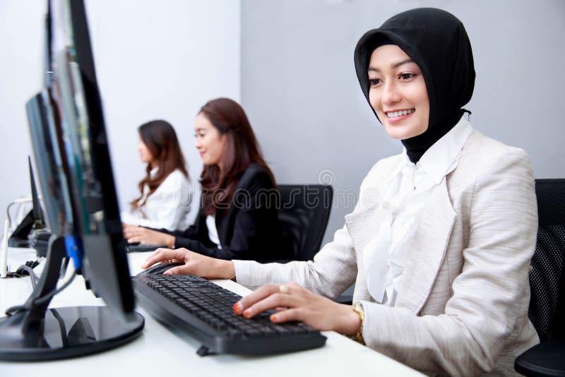 Beautiful Employee Smiling while Working at Office Stock Photo - Image ...