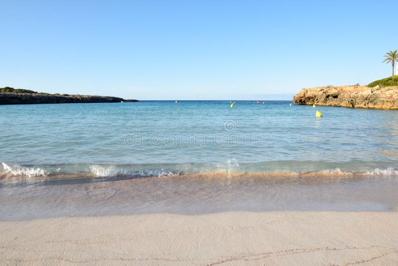 Beautiful Empty Beach with Calm Ocean Water on the Sand Stock Image ...