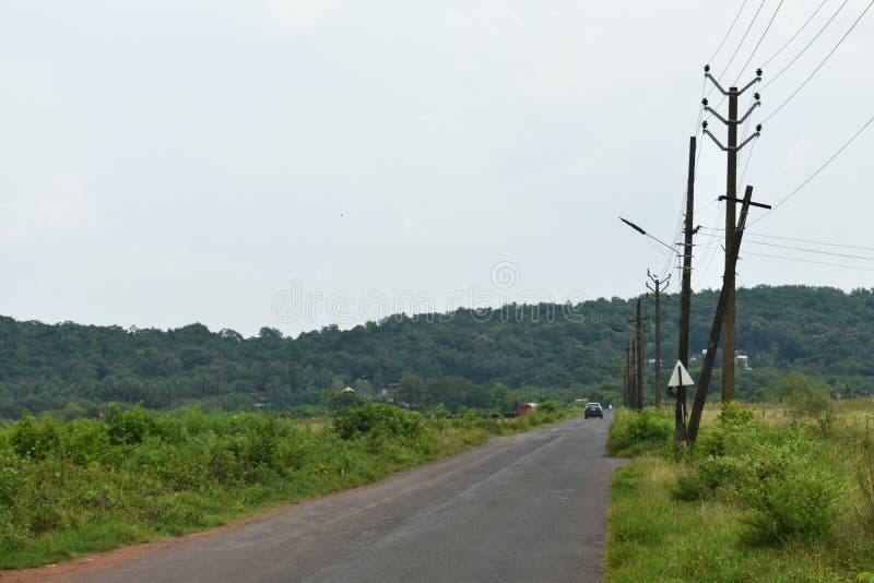 Beautiful Empty Road in Autumn Season with Green Fields and Cloudy Sky ...
