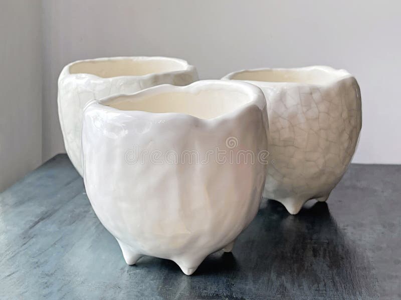 Beautiful Empty White Handmade Glaze Ceramic Pots on Blue Wooden ...