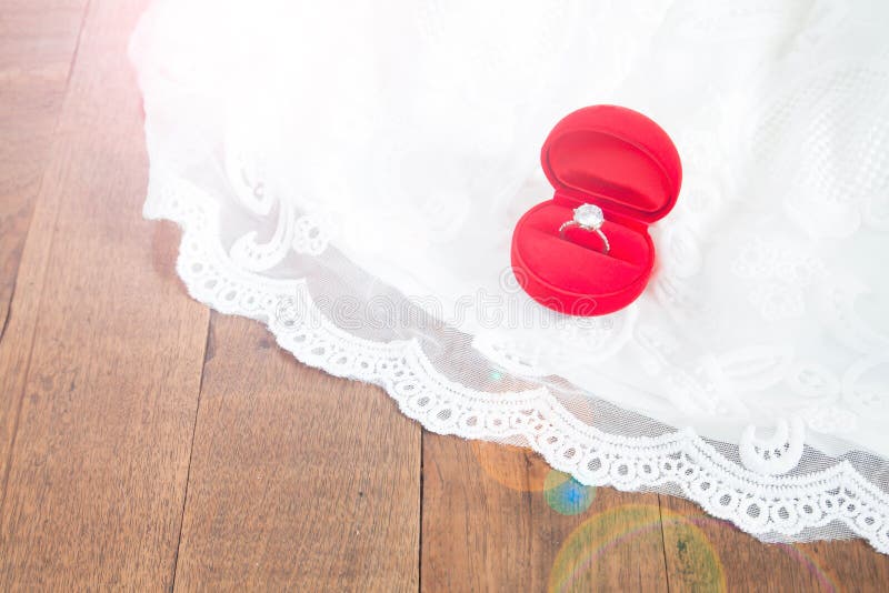 Beautiful Engagement Ring in Red Box on Bridal Gown Stock Photo - Image ...