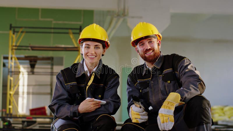 Beautiful Engineer Woman and Construction Man Smiling Large in Front of ...