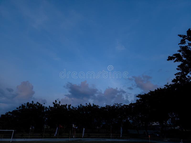 The Beautiful Evening Sky is Orange and the Clouds are Getting Dark ...