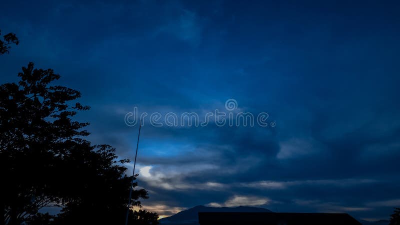 The Beautiful Evening Sky is Orange and the Clouds are Getting Dark ...