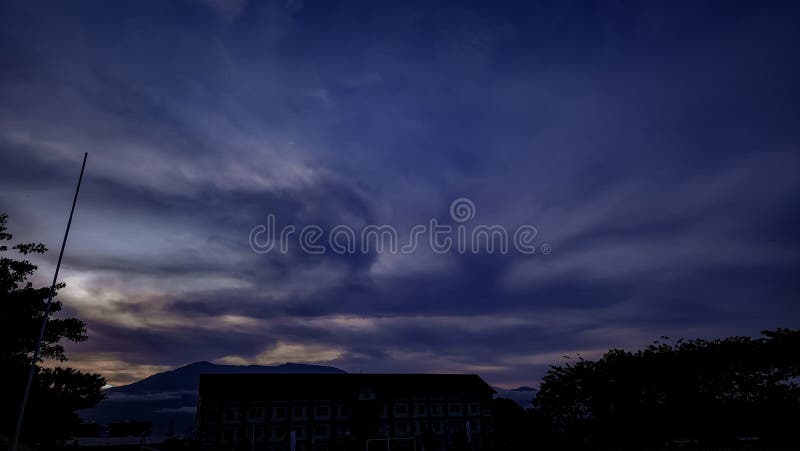 The Beautiful Evening Sky is Orange and the Clouds are Getting Dark ...