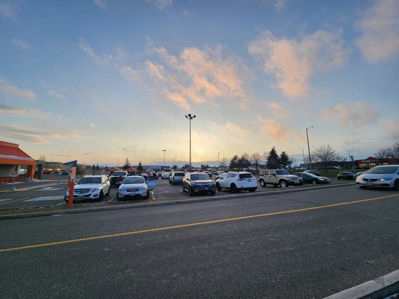 A Beautiful Evening Sunset in a Full Parking Lot Stock Photo - Image of ...