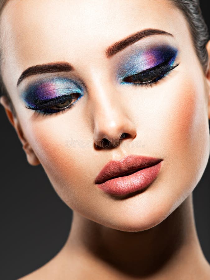 Beautiful Face of a Young Woman with Blue Makeup of Eyes Stock Photo ...