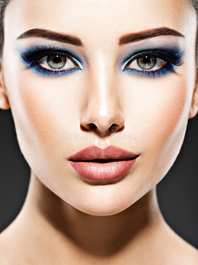 Beautiful Face of an Young Woman with Blue Makeup of Eyes Stock Photo ...