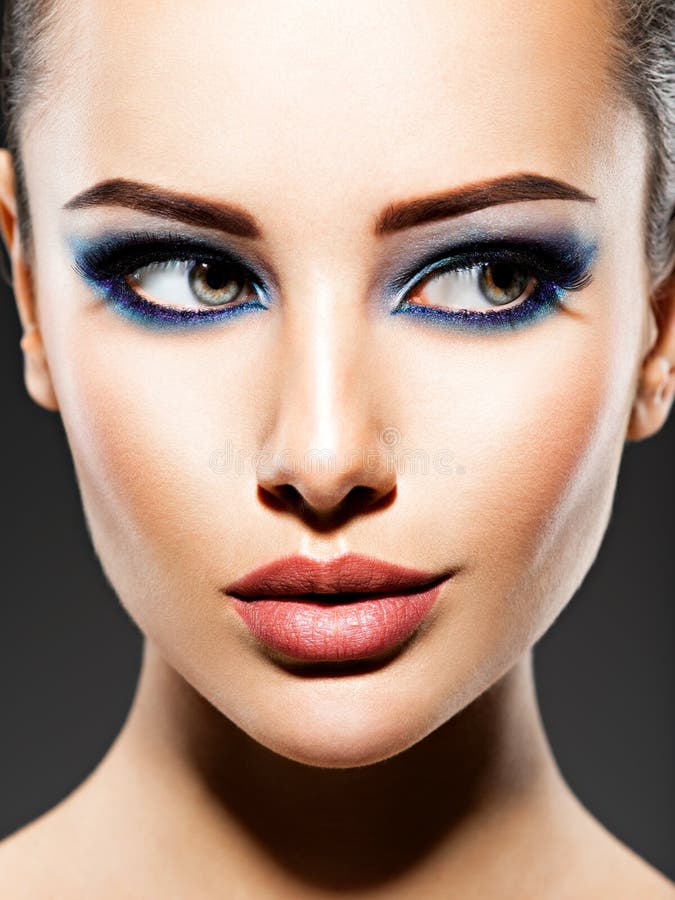 Beautiful Face of an Young Woman with Blue Makeup of Eyes Stock Photo ...