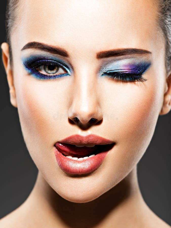 Beautiful Face of an Young Woman with Blue Makeup of Eyes Stock Photo ...