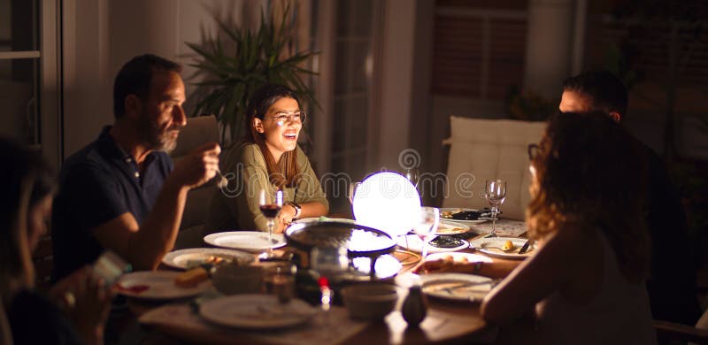 Beautiful Family on Dinner Talking and Smiling at Terrace Stock Image ...