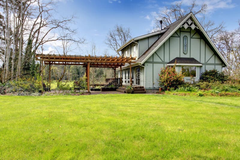 Beautiful Farmhouse with Attached Pergola. Early Spring Stock Image ...
