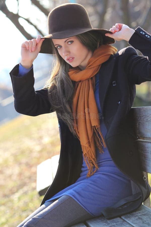 Beautiful Fashion Model Poses on a Bench Stock Image - Image of young ...