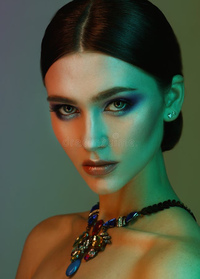 Beautiful Fashion Model Wearing Elegant Jewelry In Color Light Stock