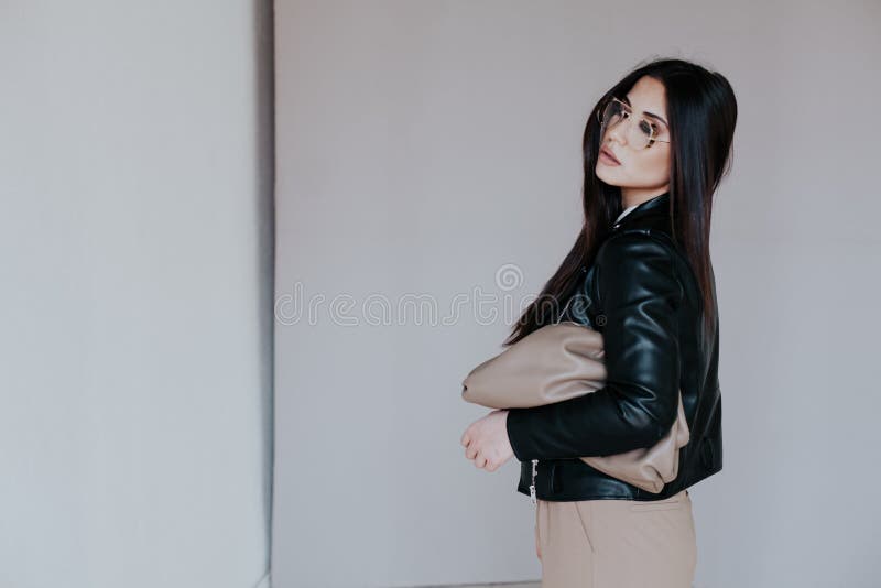 Beautiful Fashionable Eastern Brunette Woman In Black Leather Jacket