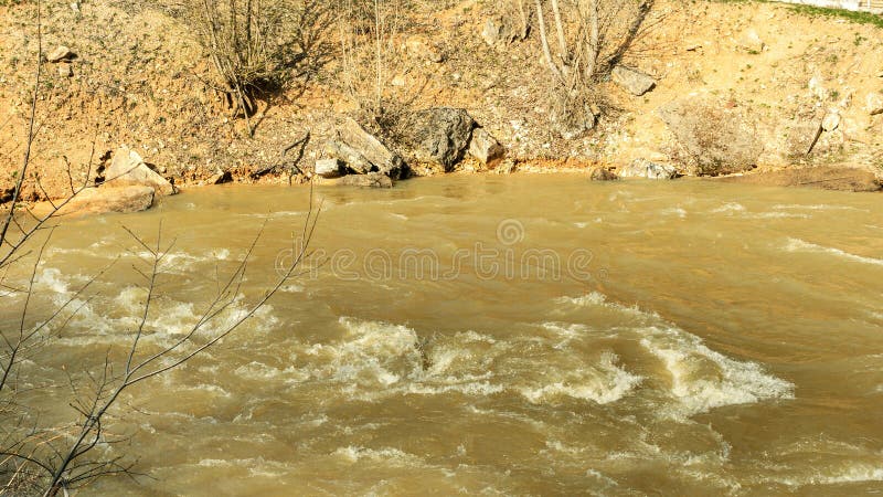 A Beautiful Fast Raging River, a Waterfall Flowing Over the Rocks ...