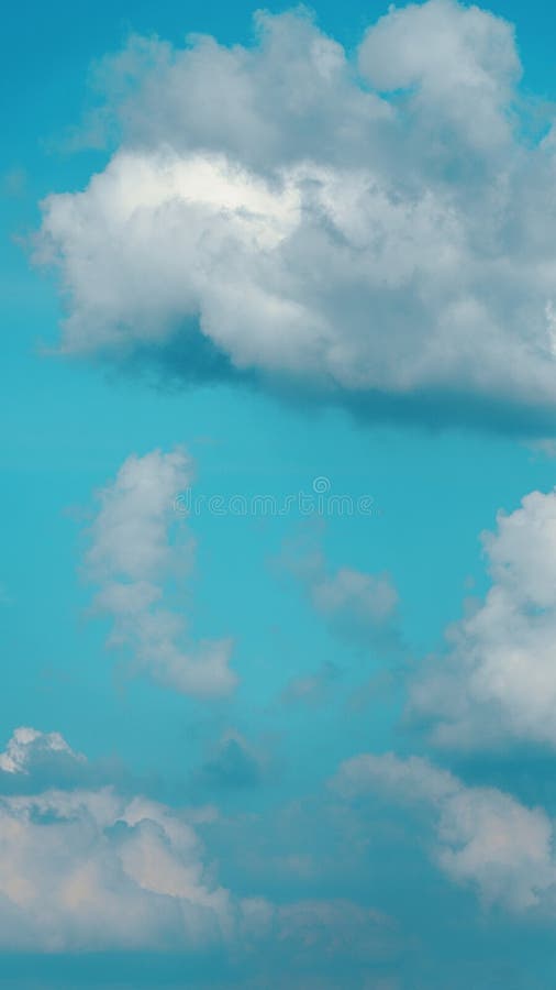 Beautiful Feather Cloud in Blue Sky. Colorful Cloudy Dramatic Sky with Fluffy Clouds. Vertical ...