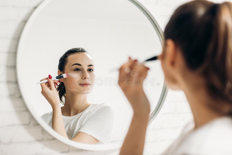 Beautiful Female Applying Cosmetics on Her Face Stock Image - Image of ...