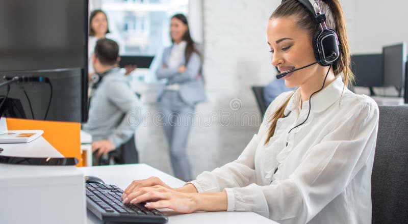 Beautiful Female Call Center Operator Working on Computer in Office ...