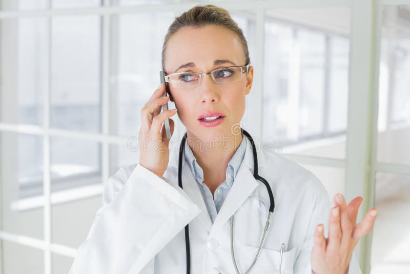 Beautiful Female Doctor Using Mobile Phone Stock Image - Image of woman ...