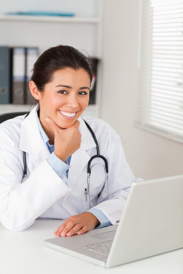 Beautiful Female Doctor Working with Her Laptop Stock Image - Image of ...