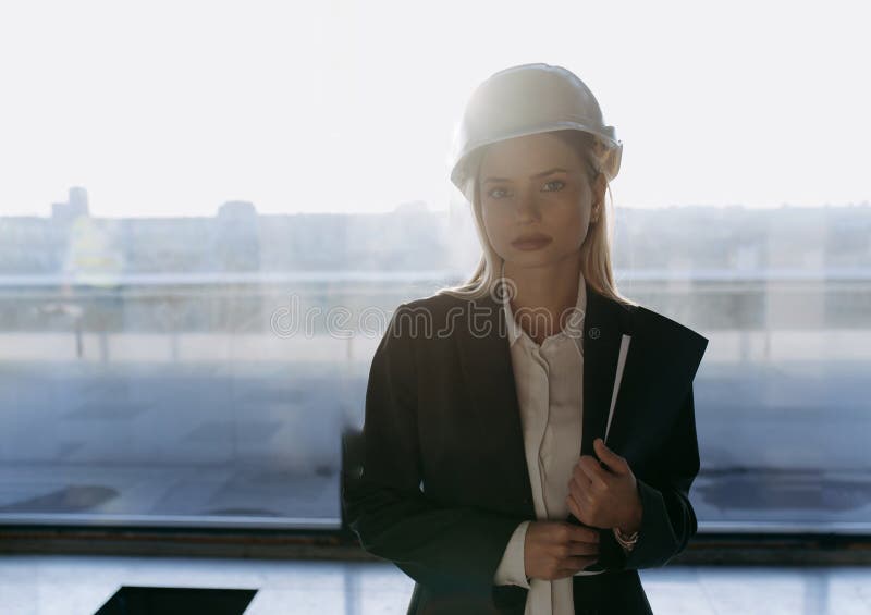 Beautiful Female Engineer in a Protective White Helmet in the Office ...