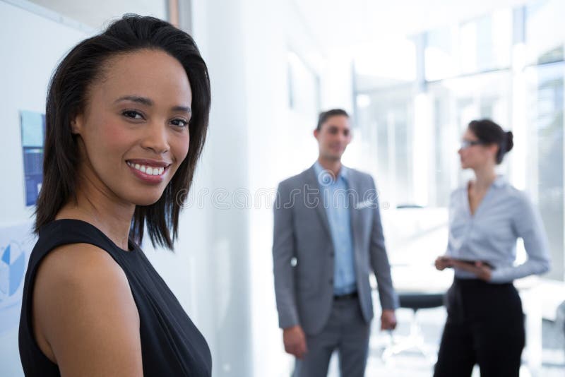 Beautiful Female Executive Looking at Camera Stock Photo - Image of ...