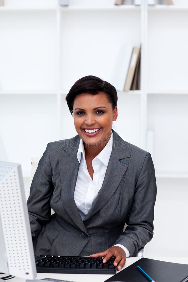 Beautiful Female Executive Working at a Computer Stock Photo - Image of ...