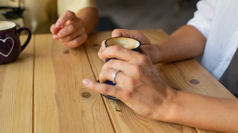 Beautiful Female Hands Hold a Cup of Coffee in a Cafe Stock Photo ...