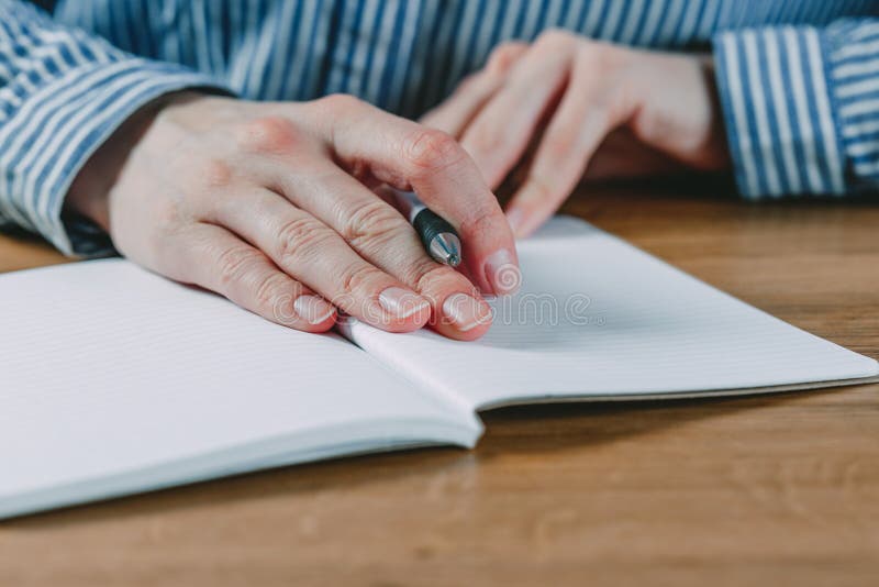 Beautiful Female Hands Write Pen in a Notebook of Tasks and Goals To ...