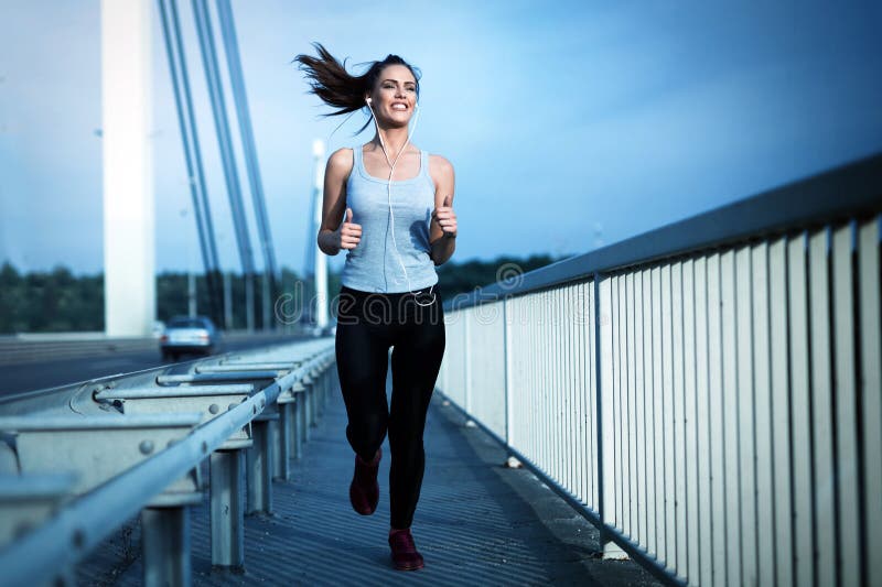 Beautiful Female Jogger on Her Morning Run Stock Photo - Image of dawn ...