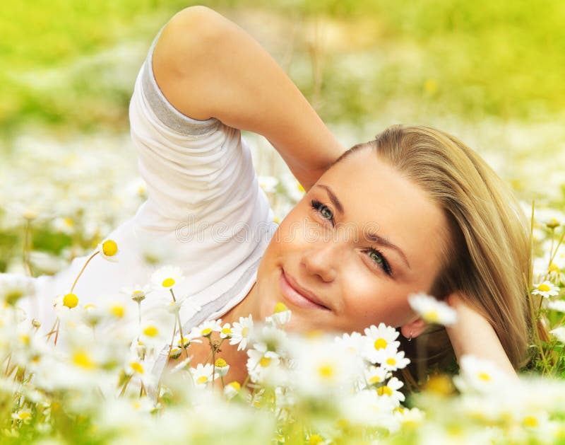 Woman Lying in Meadow of Flowers Stock Image - Image of outdoor, field ...