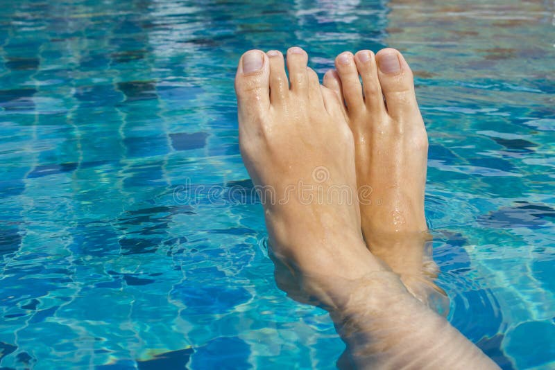 Beautiful Female Legs Relax in Clear Water. Stock Image - Image of ...
