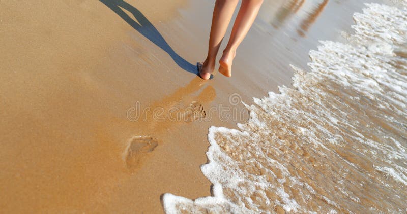 Female Legs Walk on the Sea Sand. Stock Photo - Image of female ...