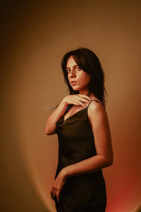 Beautiful Female Model Posing in an Elegant Dress in a Studio with ...