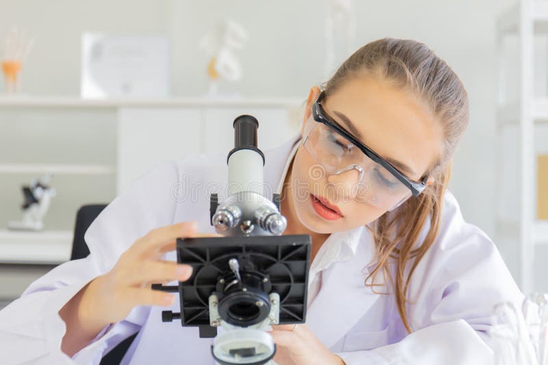 Beautiful Female Scientist is Operating in a Science Lab with Various ...