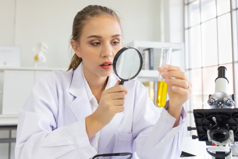 Beautiful Female Scientist is Operating in a Science Lab with Various ...