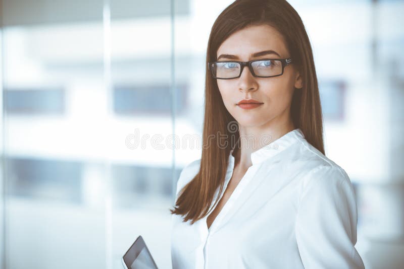 Beautiful Female Specialist with Tablet Computer Standing in Modern ...