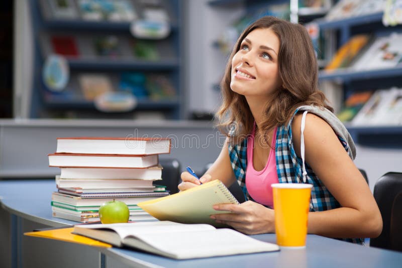 Beautiful Female Student in a Library Stock Image - Image of caucasian ...