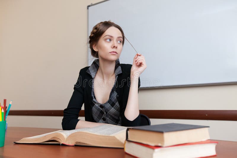 Beautiful Female Student at a Table with Books Stock Image - Image of ...