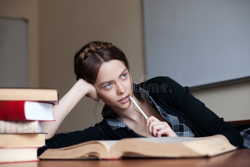 Beautiful Female Student at a Table with Books Stock Image - Image of ...
